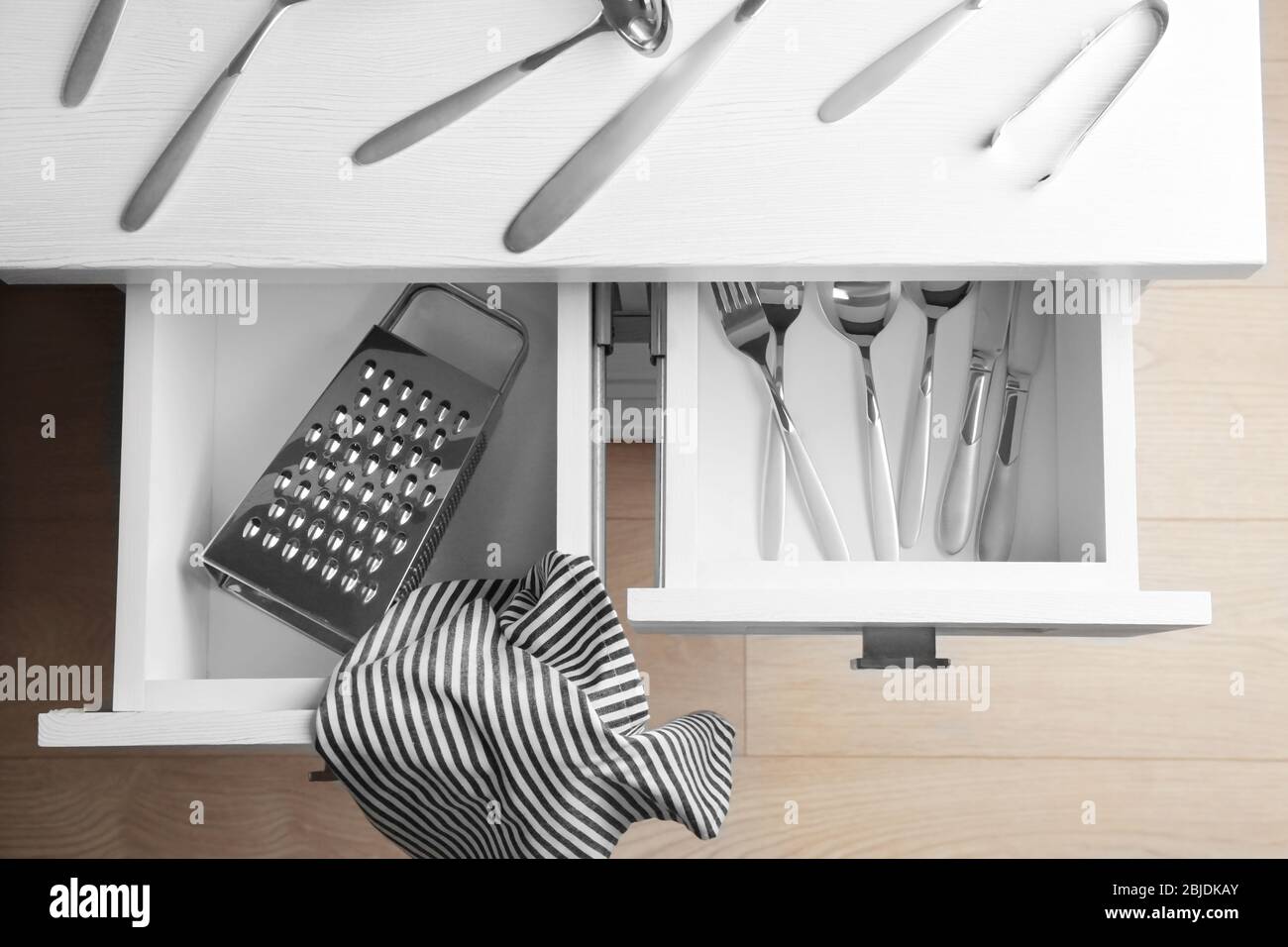 Chest of drawers with cutlery set, top view Stock Photo - Alamy