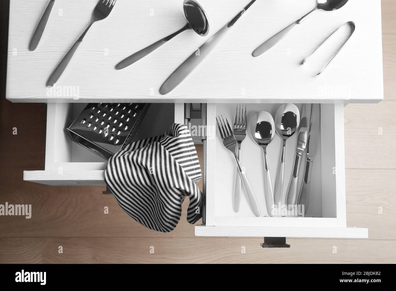 Chest of drawers with cutlery set, top view Stock Photo - Alamy