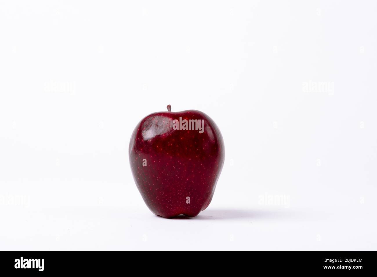 Portrait Of Red Apple Against White Background Stock Photo - Alamy