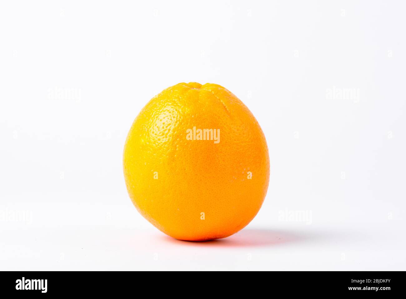 Portrait Of Single Orange Against White Background Stock Photo - Alamy