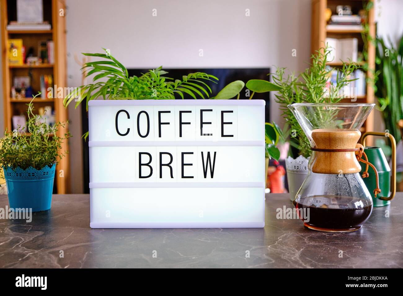 Lightbox written "Coffee Brew". Home environment in the background ...