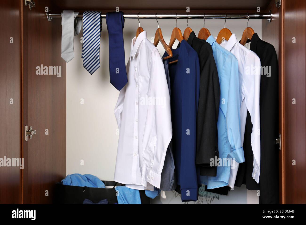Many man's clothes in wardrobe, closeup Stock Photo - Alamy