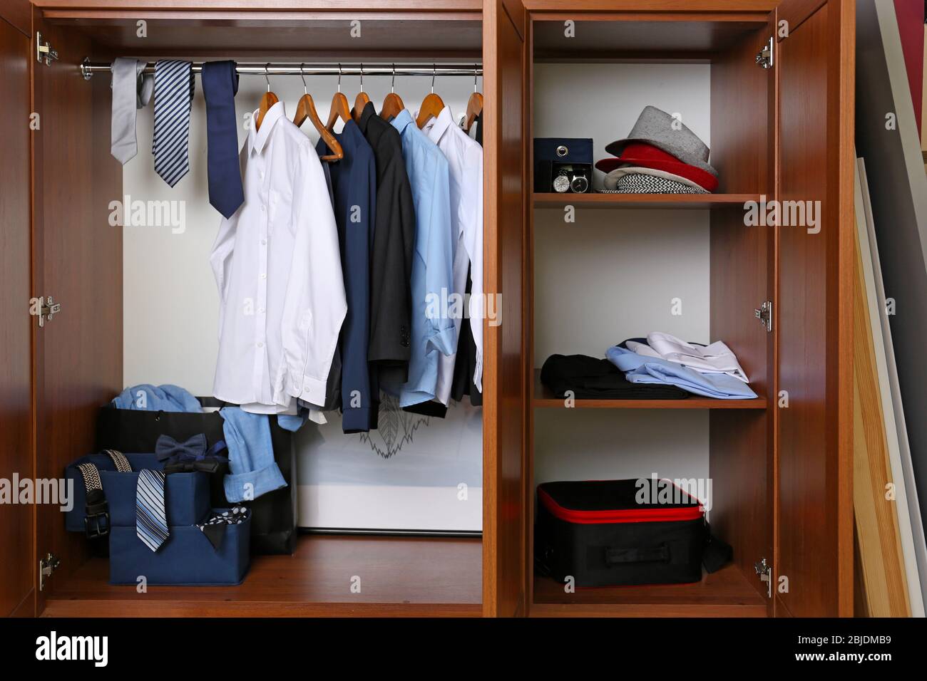 Many man's clothes in wardrobe, closeup Stock Photo - Alamy