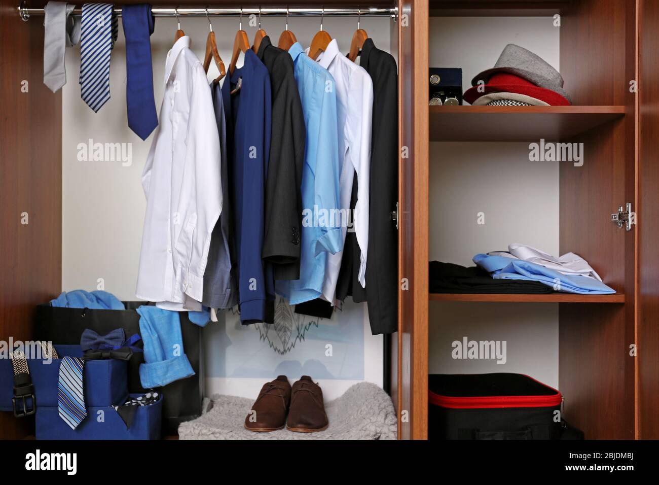Many man's clothes in wardrobe, closeup Stock Photo - Alamy