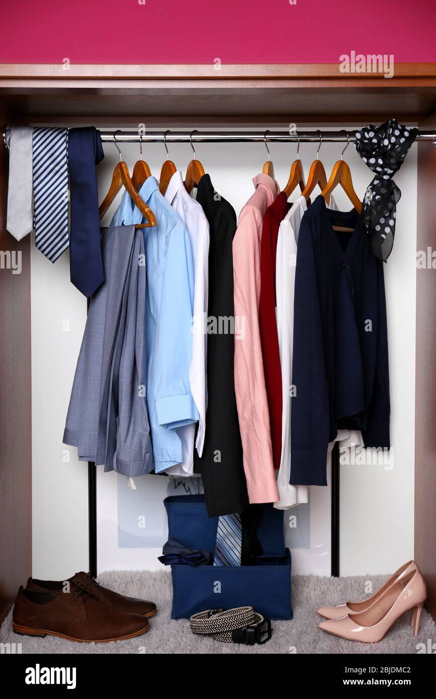 Many clothes in wardrobe, closeup Stock Photo - Alamy