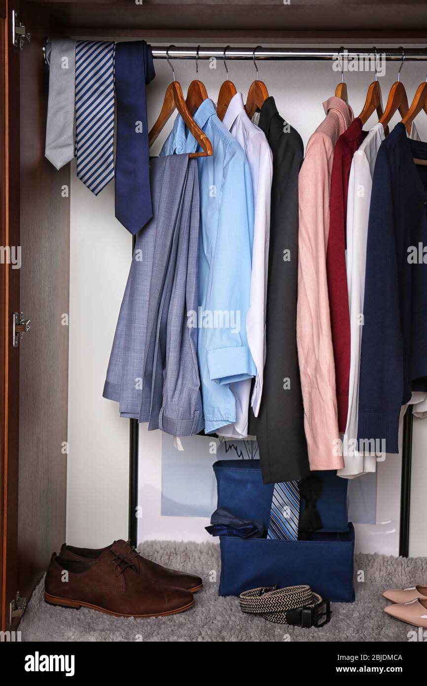 Many clothes in wardrobe, closeup Stock Photo - Alamy