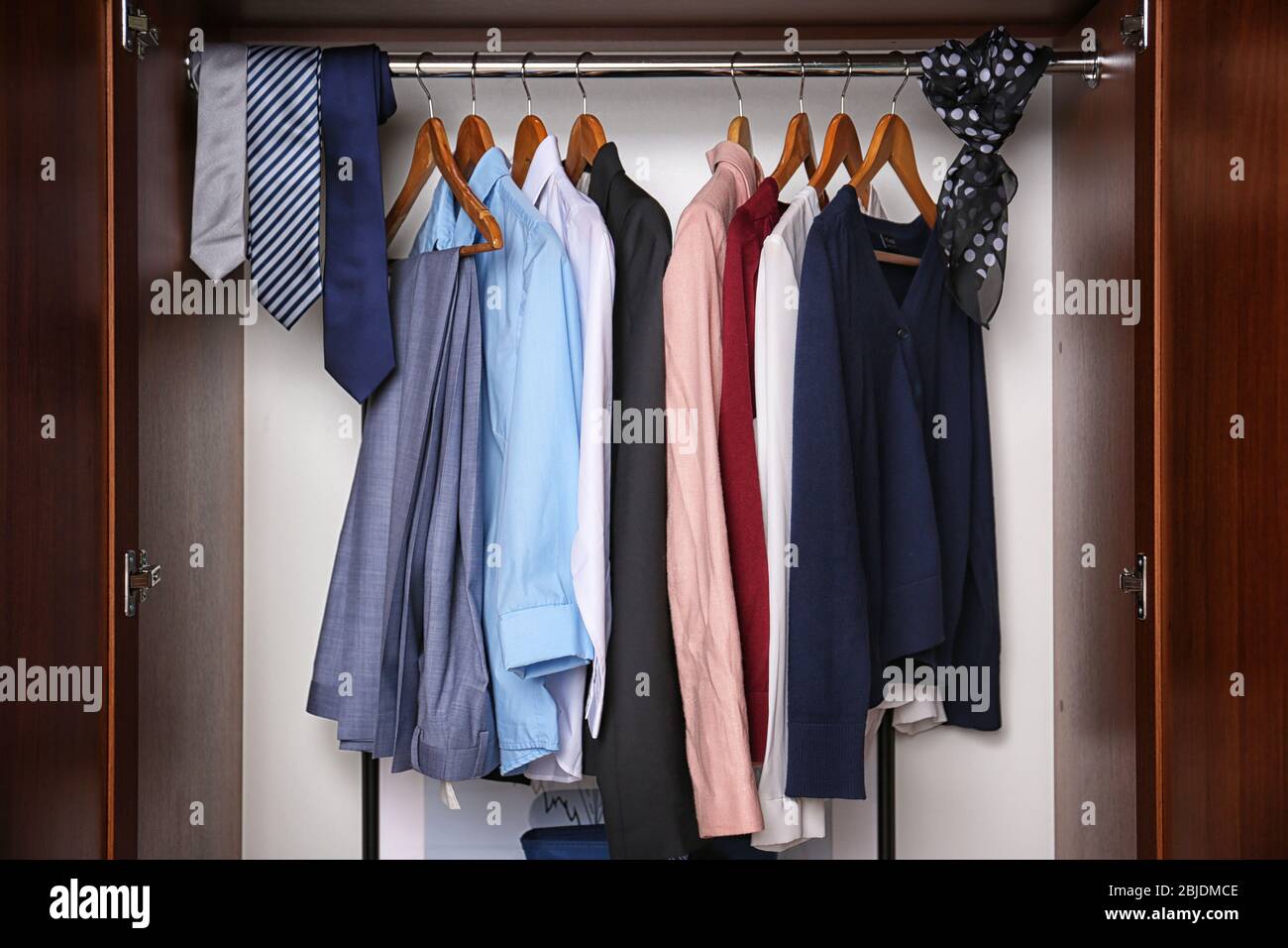 Many clothes in wardrobe, closeup Stock Photo - Alamy