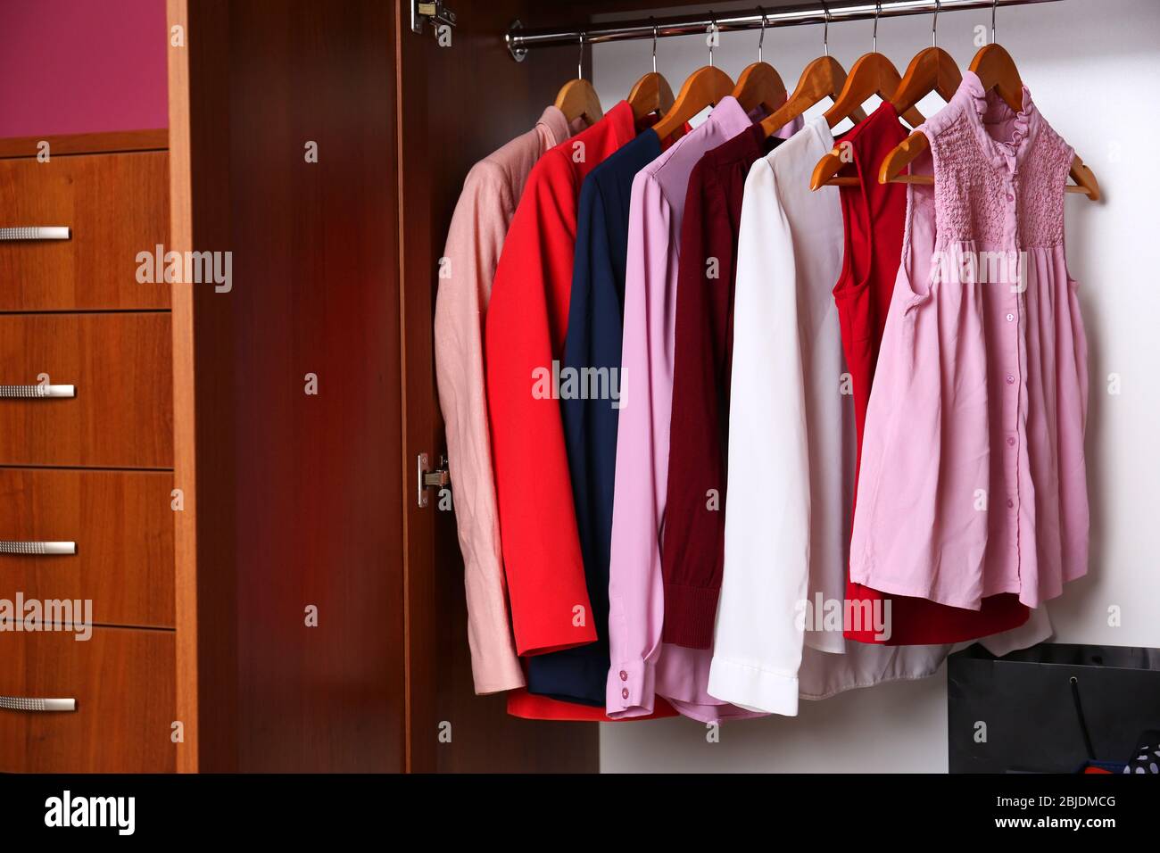 Elegant female clothes in wardrobe, closeup Stock Photo - Alamy