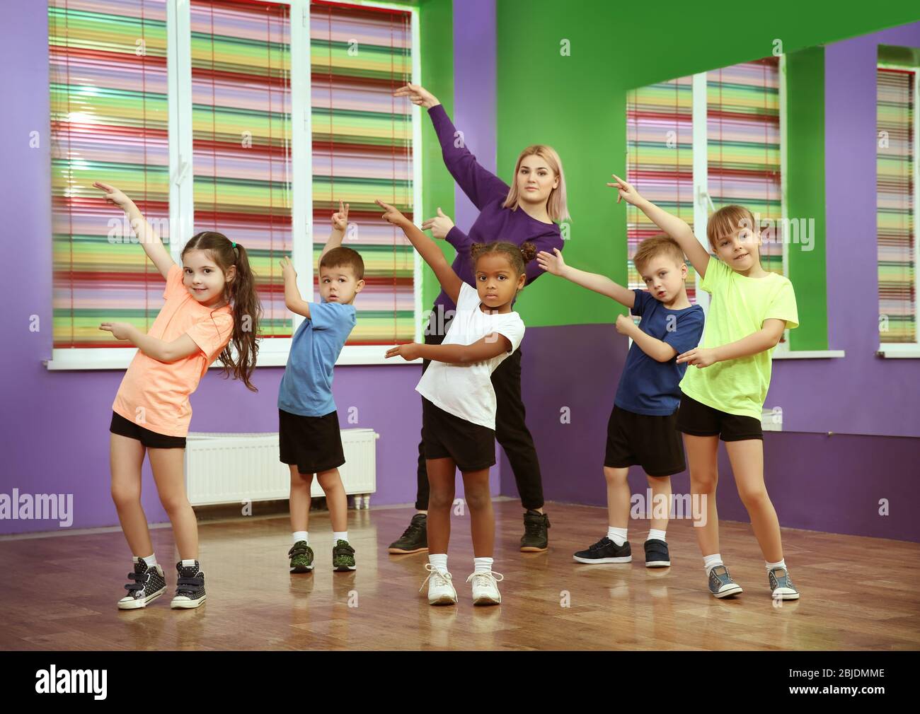Dance teacher and children in choreography class Stock Photo - Alamy