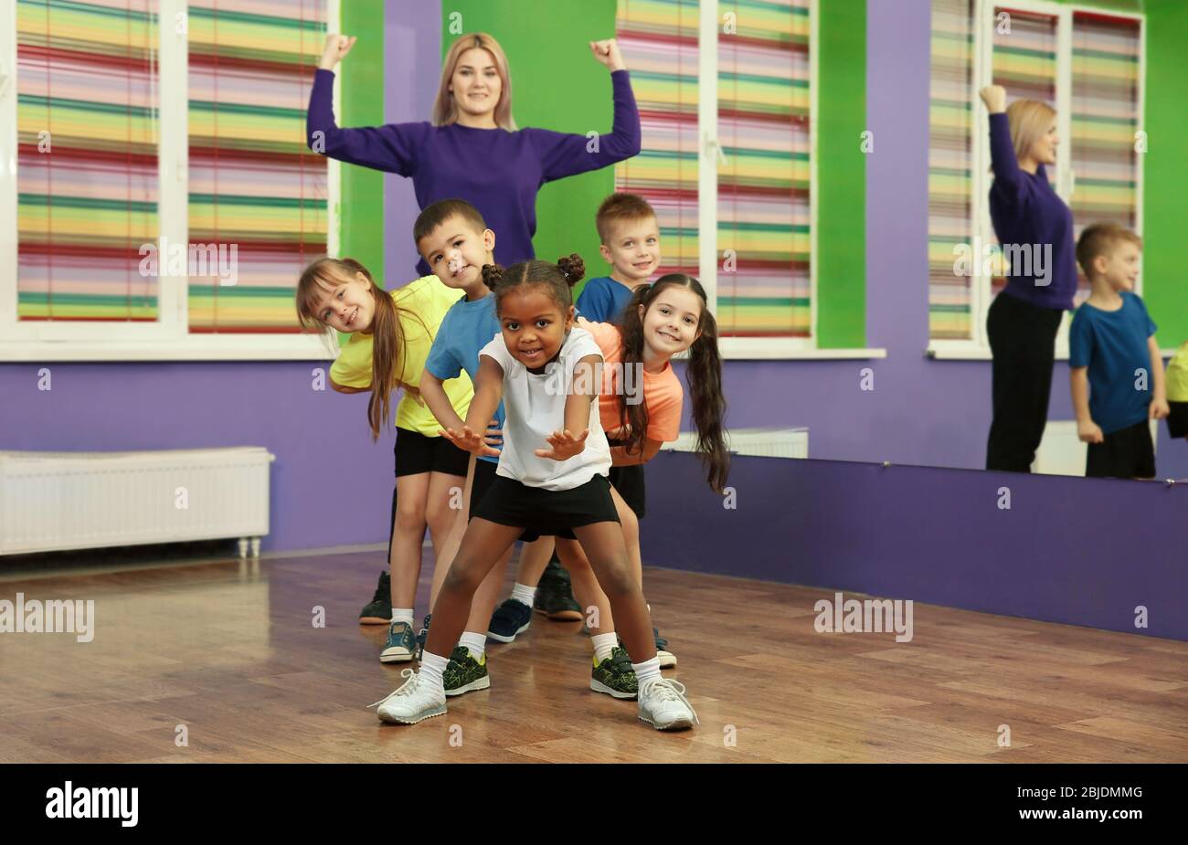 Dance teacher and children in choreography class Stock Photo - Alamy