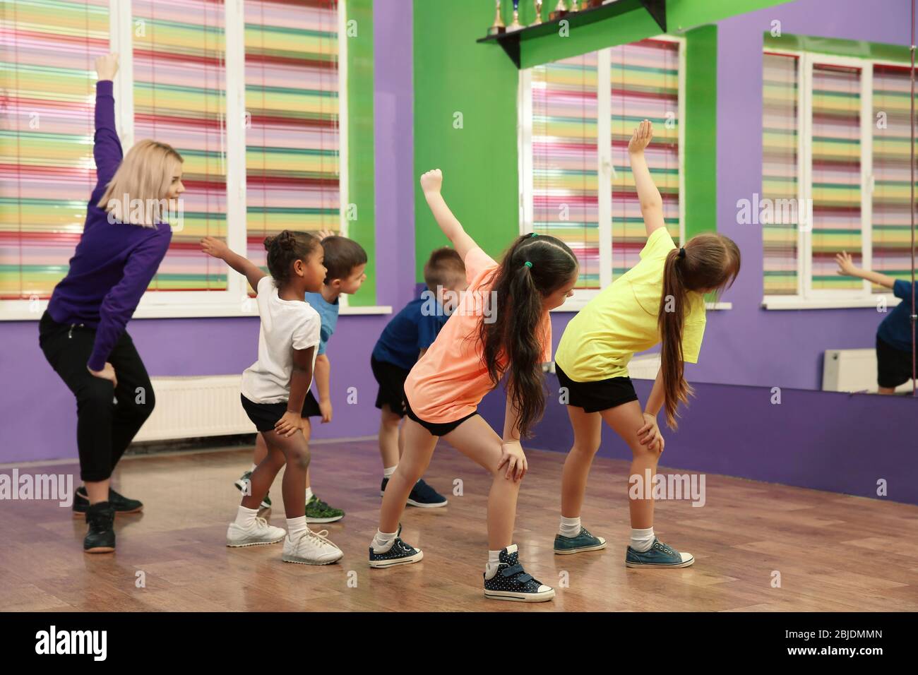 Dance teacher and children in choreography class Stock Photo - Alamy