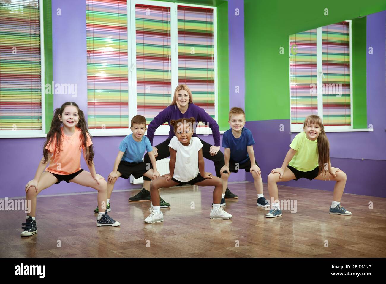 Dance teacher and children in choreography class Stock Photo - Alamy