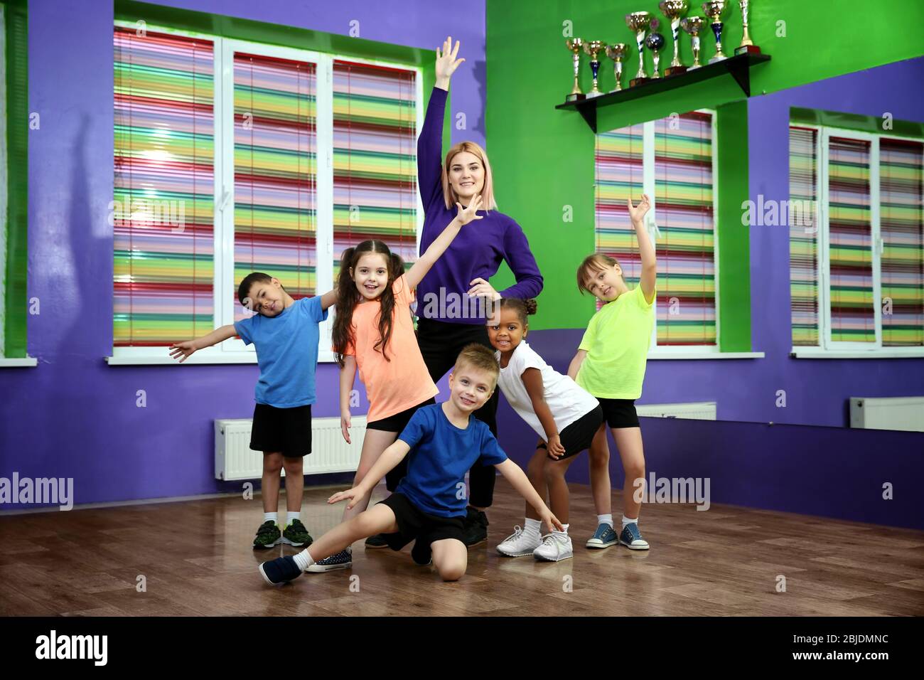 Dance teacher and children in choreography class Stock Photo - Alamy