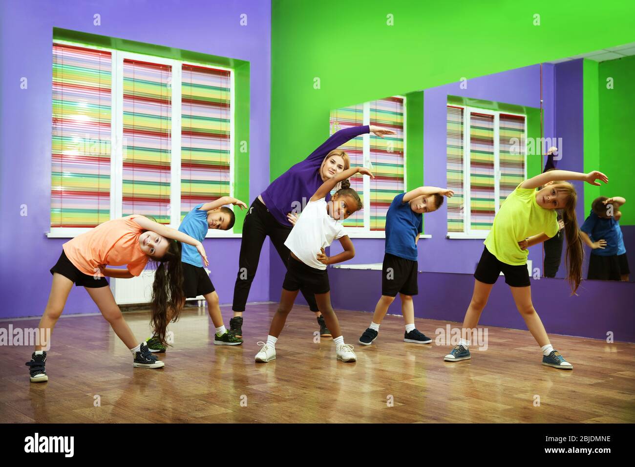 Dance teacher and children in choreography class Stock Photo - Alamy