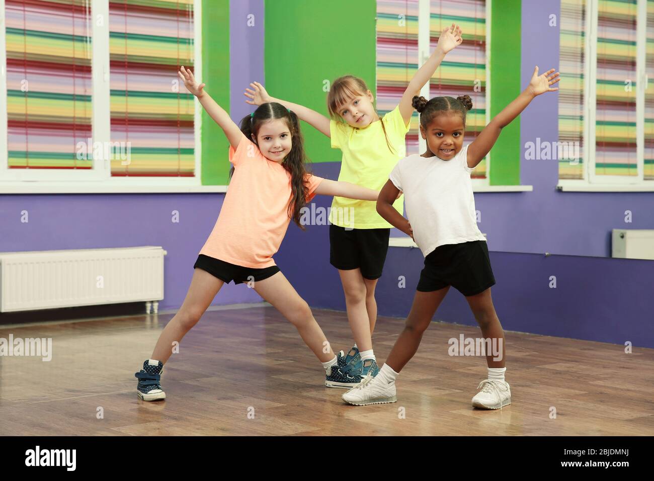 Cute little girls dancing in choreography class Stock Photo - Alamy