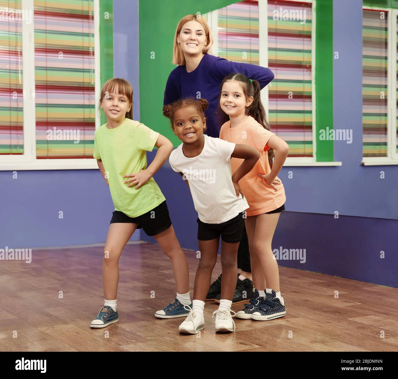 Dance teacher and children in choreography class Stock Photo - Alamy