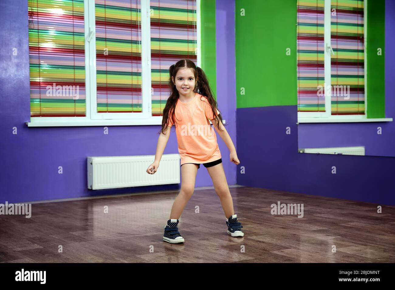 Cute little girl dancing in choreography class Stock Photo - Alamy