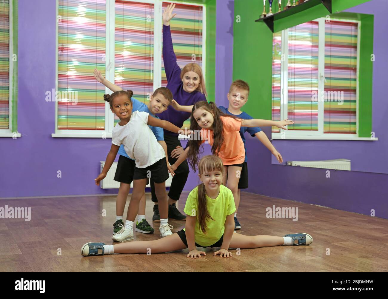 Dance teacher and children in choreography class Stock Photo - Alamy