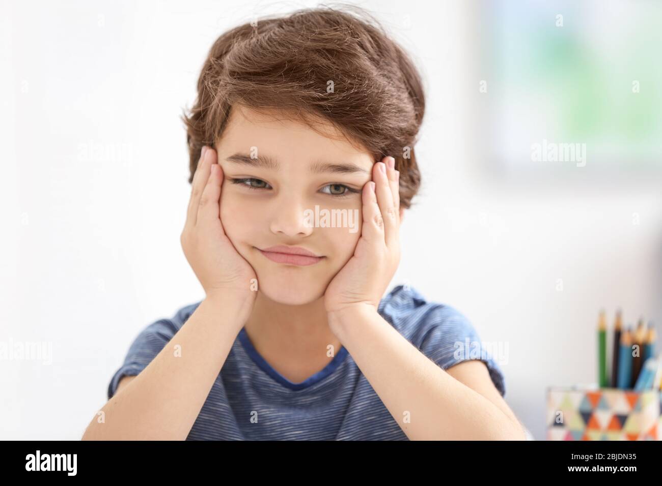 Cute little boy thinking about something, on blurred background Stock ...