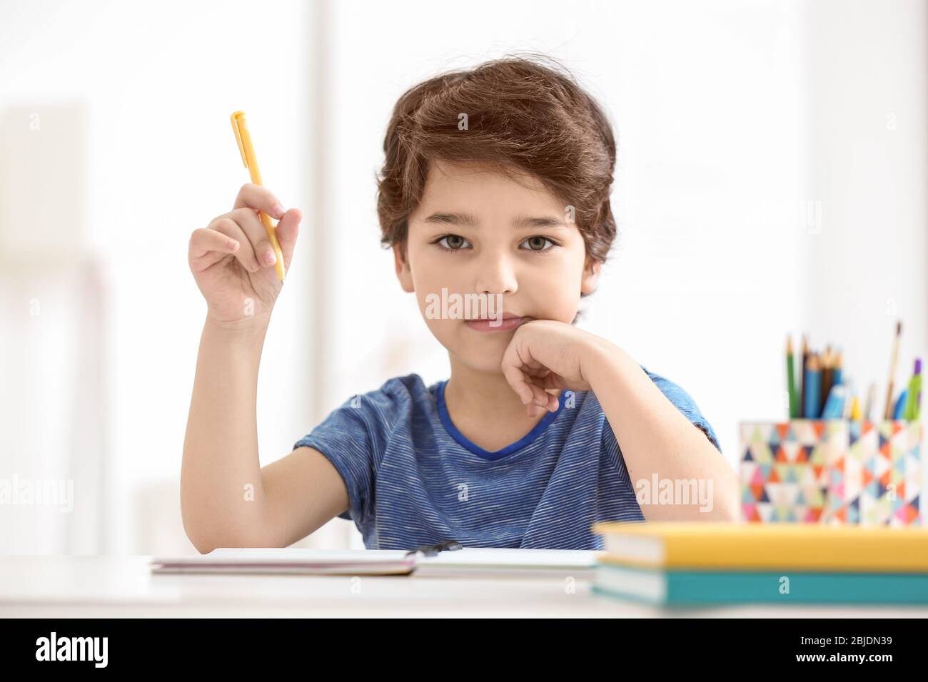 Cute little boy thinking about something, on blurred background Stock ...