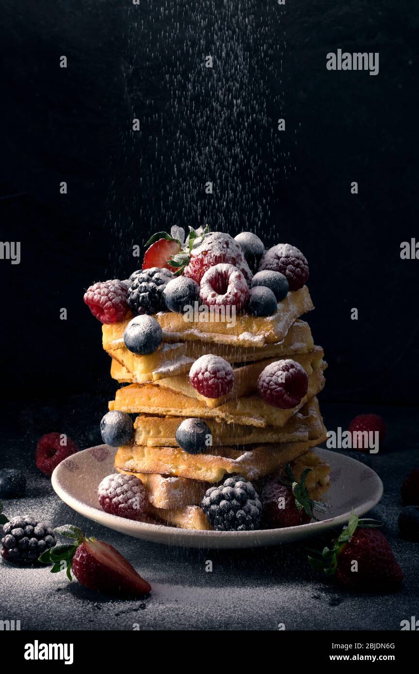 Traditional homemade Belgian waffles with fresh summer berries ...