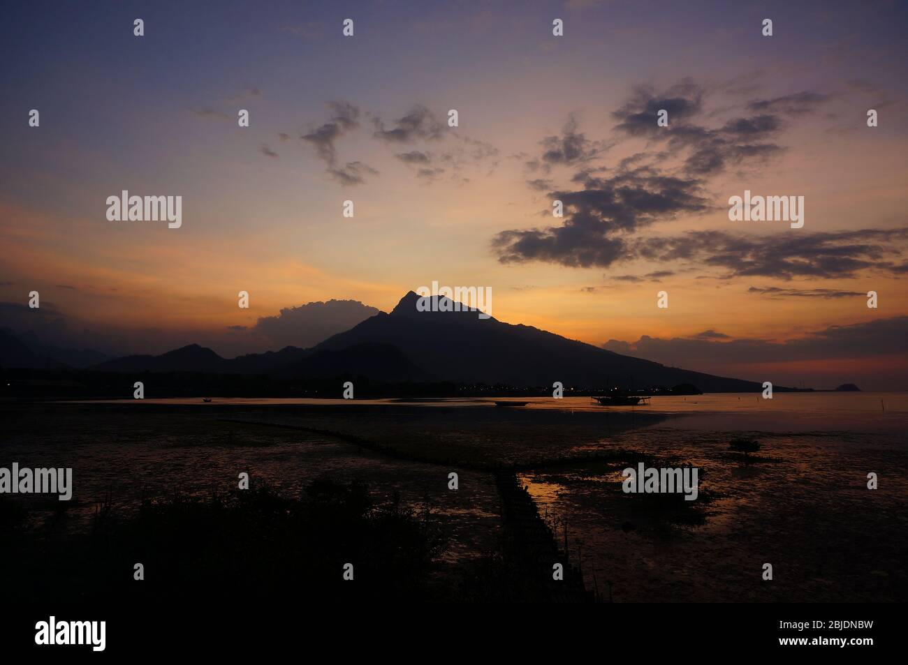 sunset or sunrise behind the mountain, north coast of the island of ...