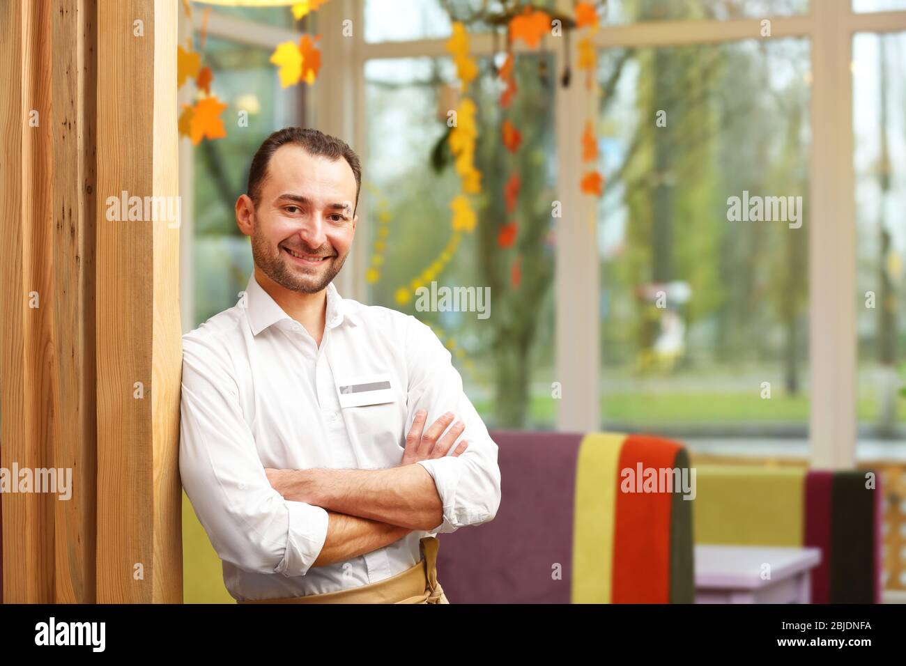 Handsome waiter restaurant interior hi-res stock photography and images ...