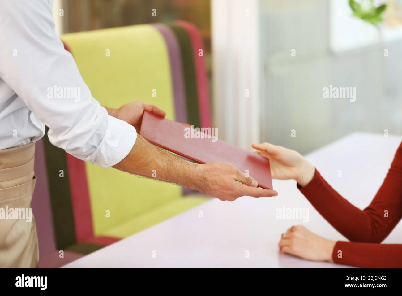 Waiter showing woman dinner table hi-res stock photography and images ...