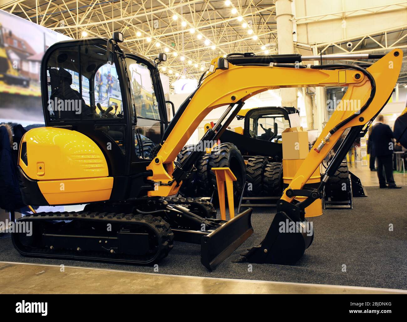Heavy crawler excavator on municipal cars exhibition Stock Photo - Alamy