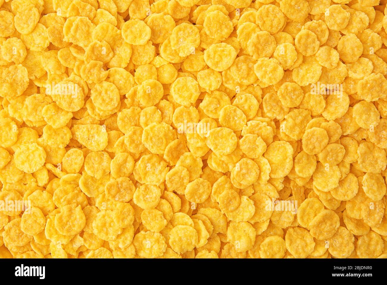 Crispy cornflakes background Stock Photo - Alamy