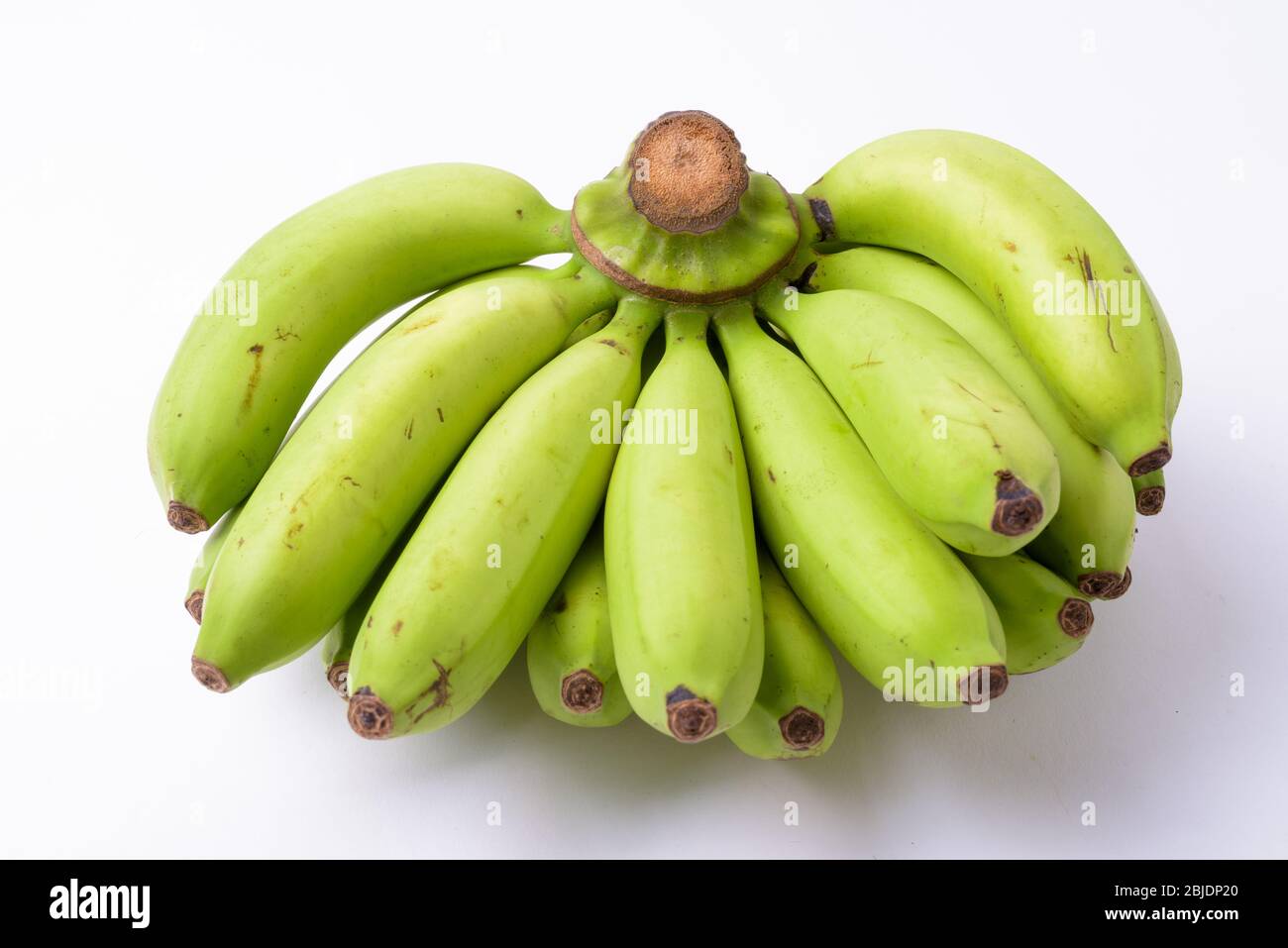 Portrait Of Green Bananas Against White Background Stock Photo - Alamy