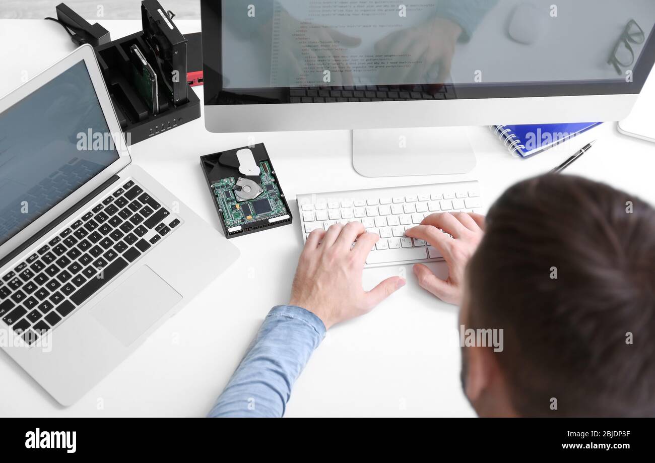 Handsome young programmer working at home Stock Photo - Alamy