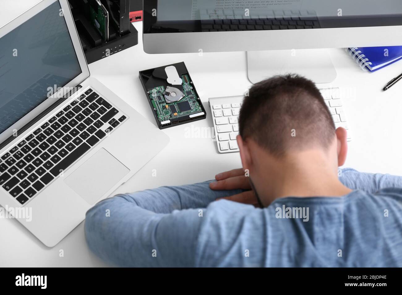 Handsome young programmer working at home Stock Photo - Alamy