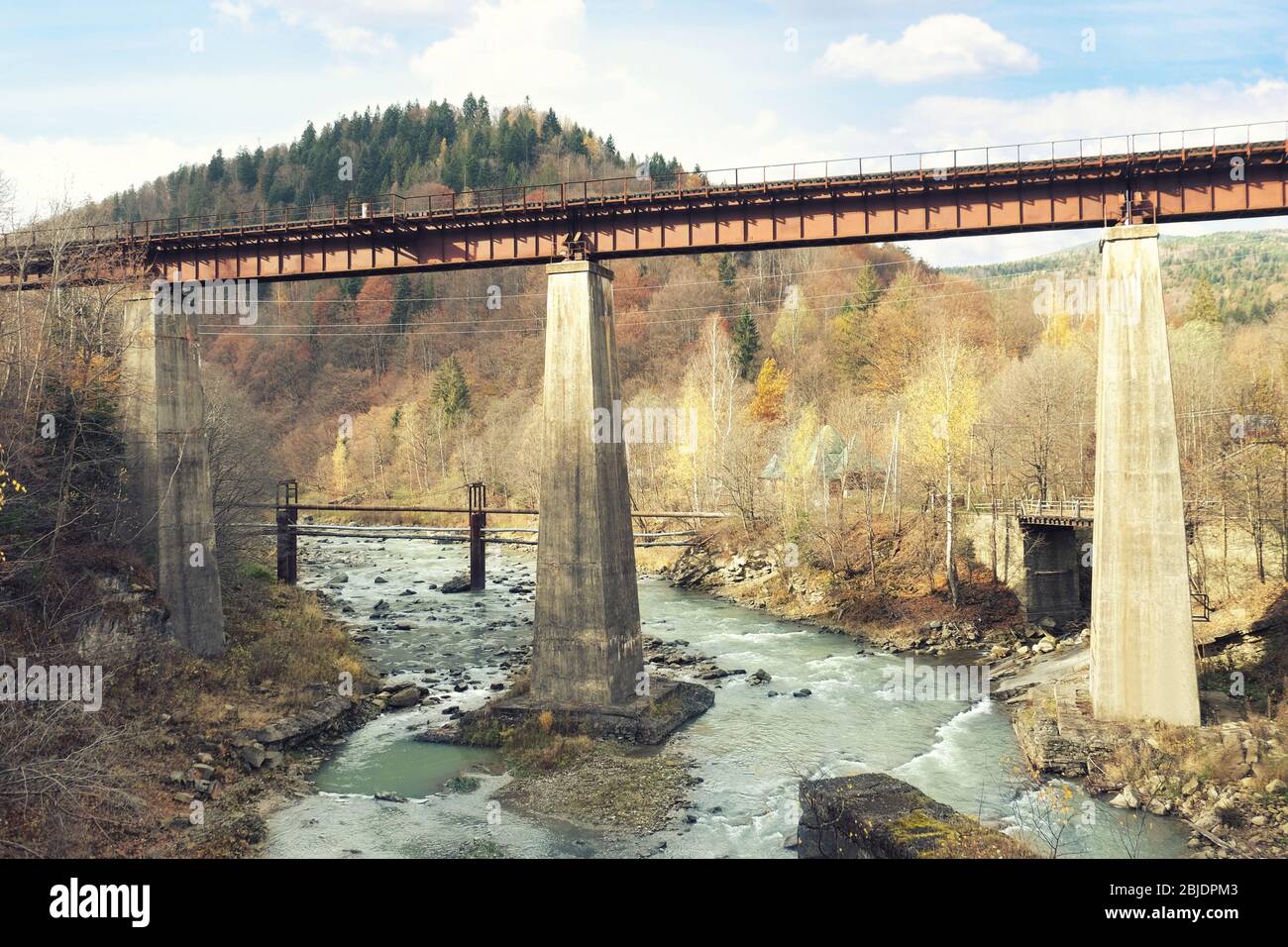 Bridge over mountain river Stock Photo - Alamy