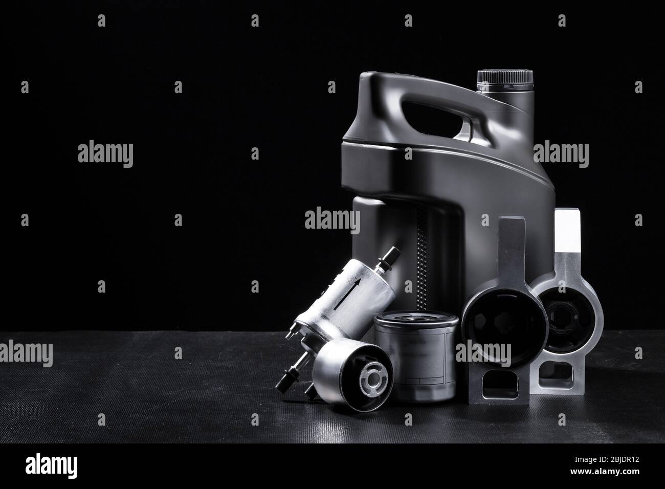 New car parts on a dark background Stock Photo - Alamy