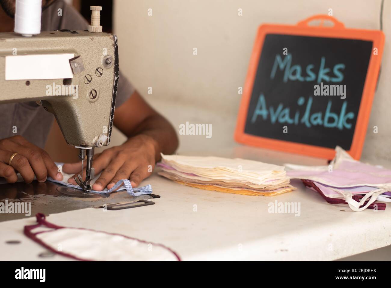 Small business of mask producing and selling at home in India due ...