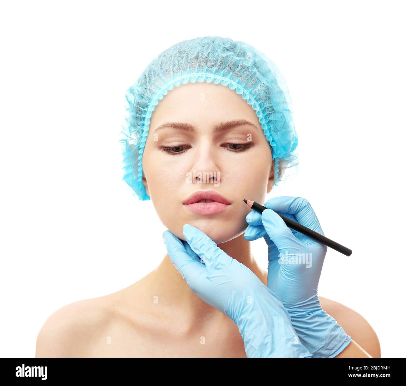 Plastic surgeon drawing line on female face, on white background Stock ...