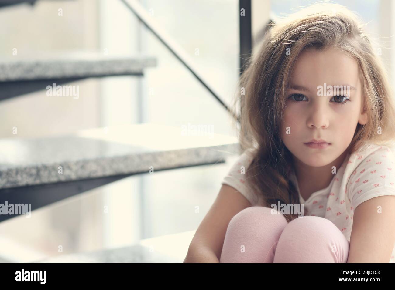 Child home stairs sad hi-res stock photography and images - Alamy