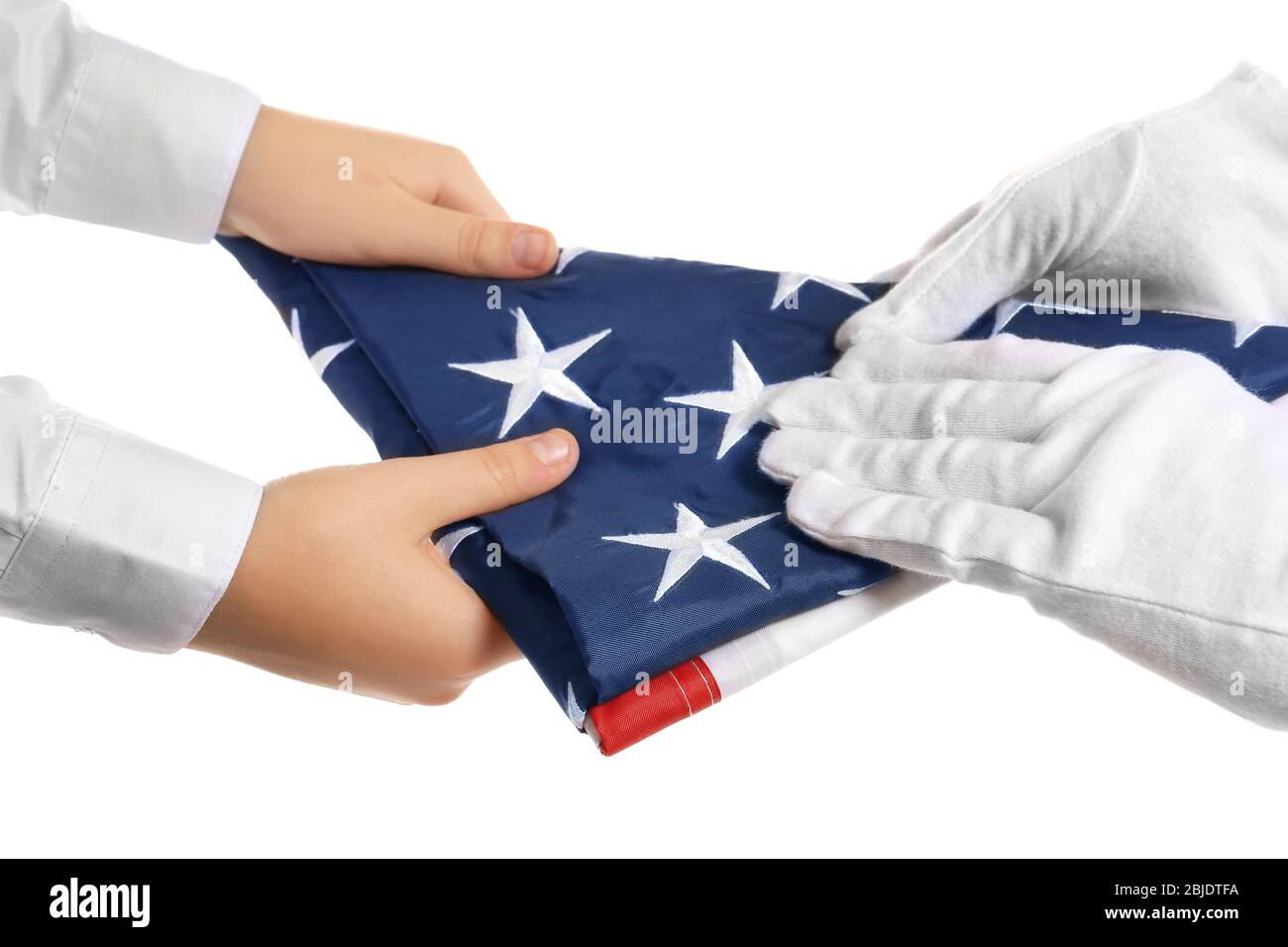 Hands holding folded American flag on white background Stock Photo - Alamy
