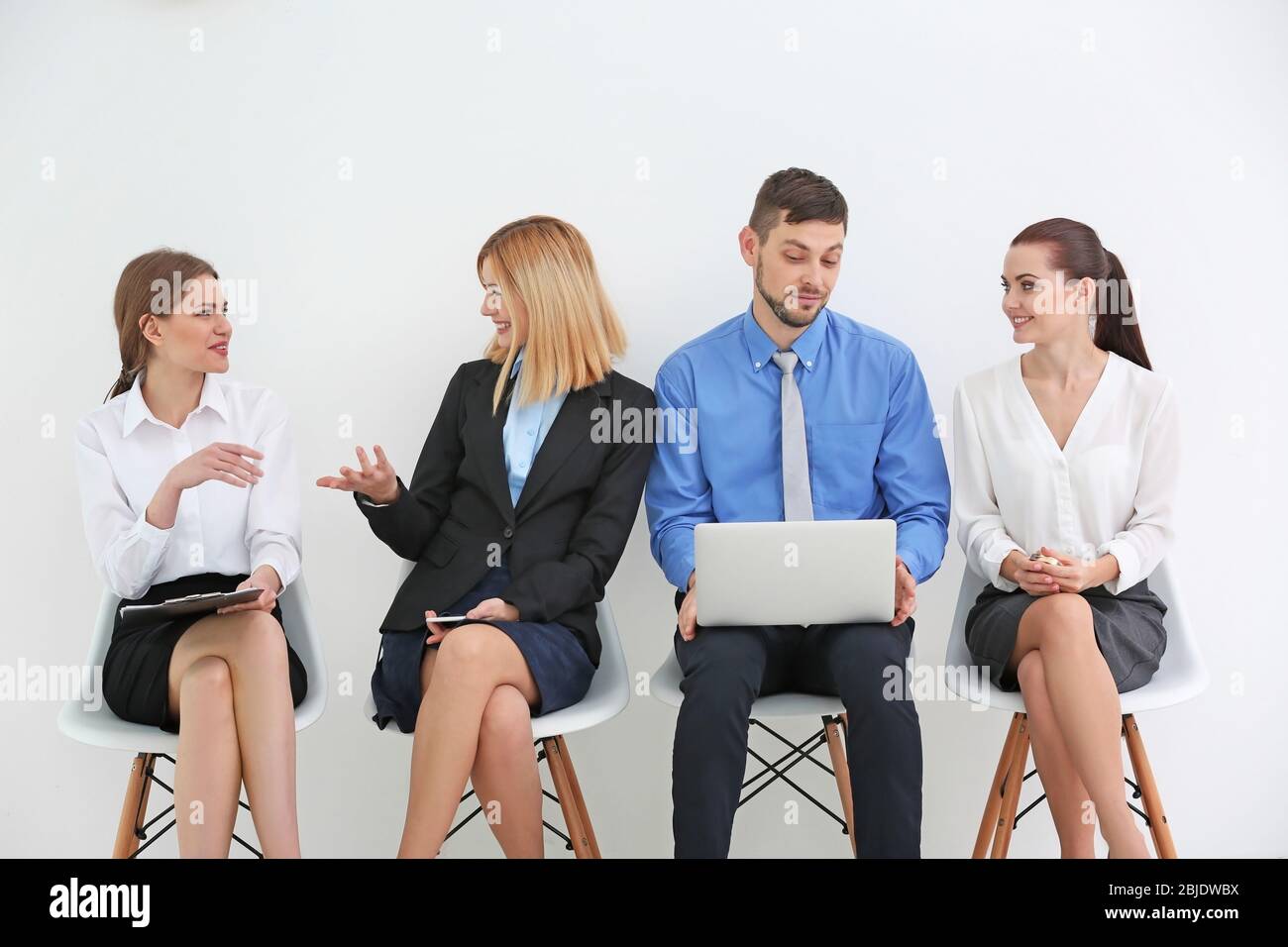 Group of people waiting for job interview in office hall Stock Photo ...
