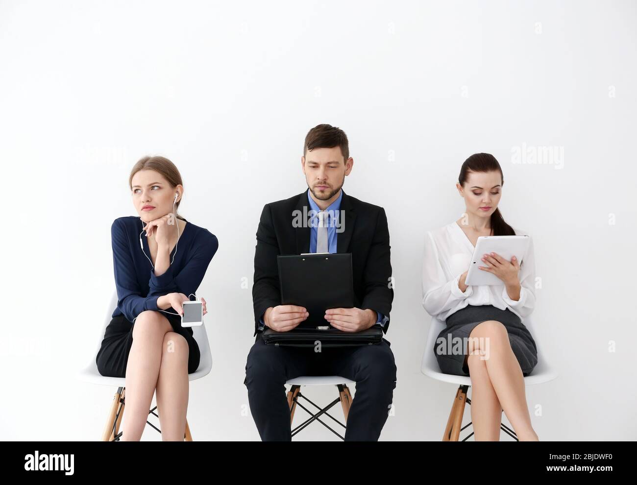 Group of people waiting for job interview on white background Stock ...