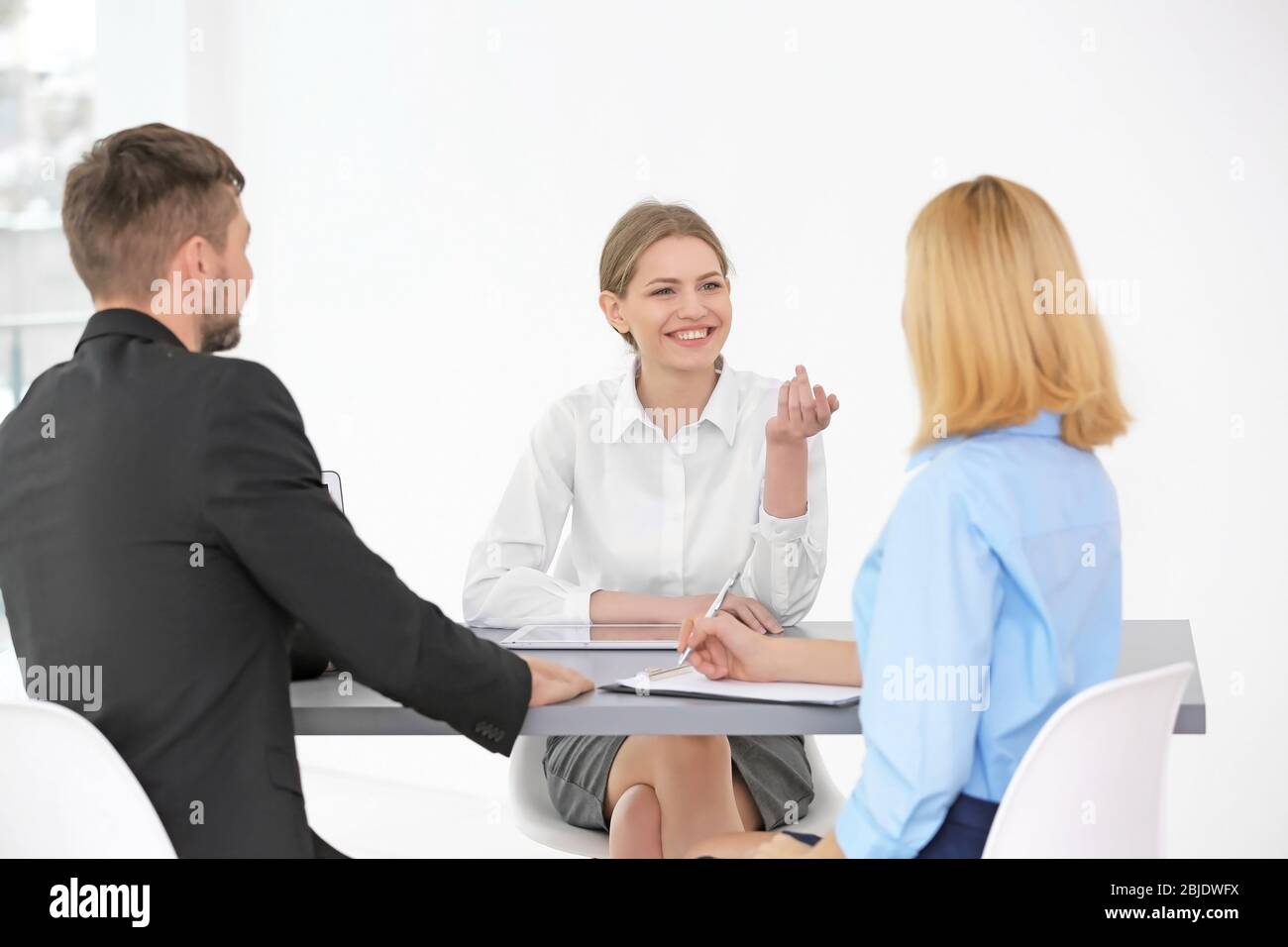 Job interview concept. Human resources commission interviewing woman ...