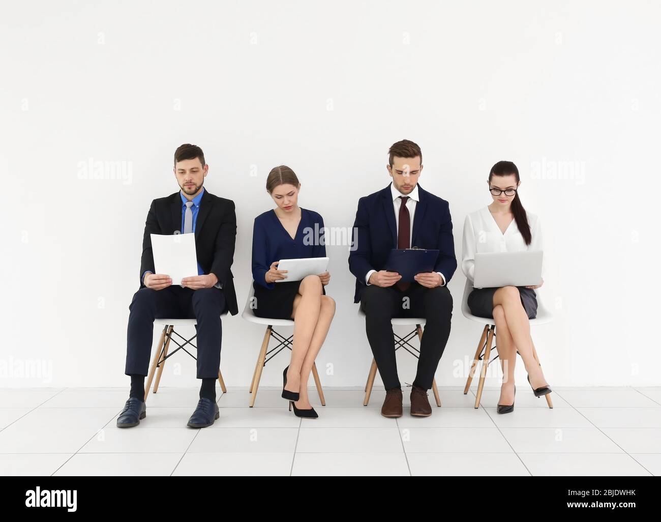 Group of people waiting for job interview on white background Stock ...