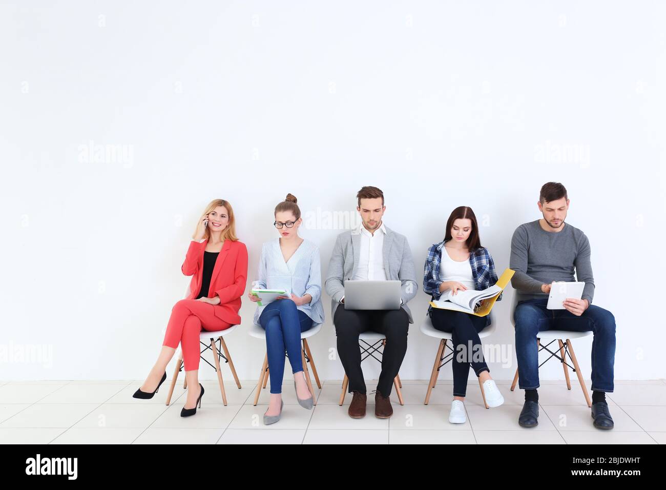 Group of people waiting for job interview on white background Stock ...