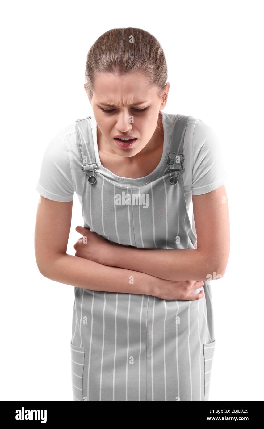 Young woman suffering from pain on white background Stock Photo - Alamy