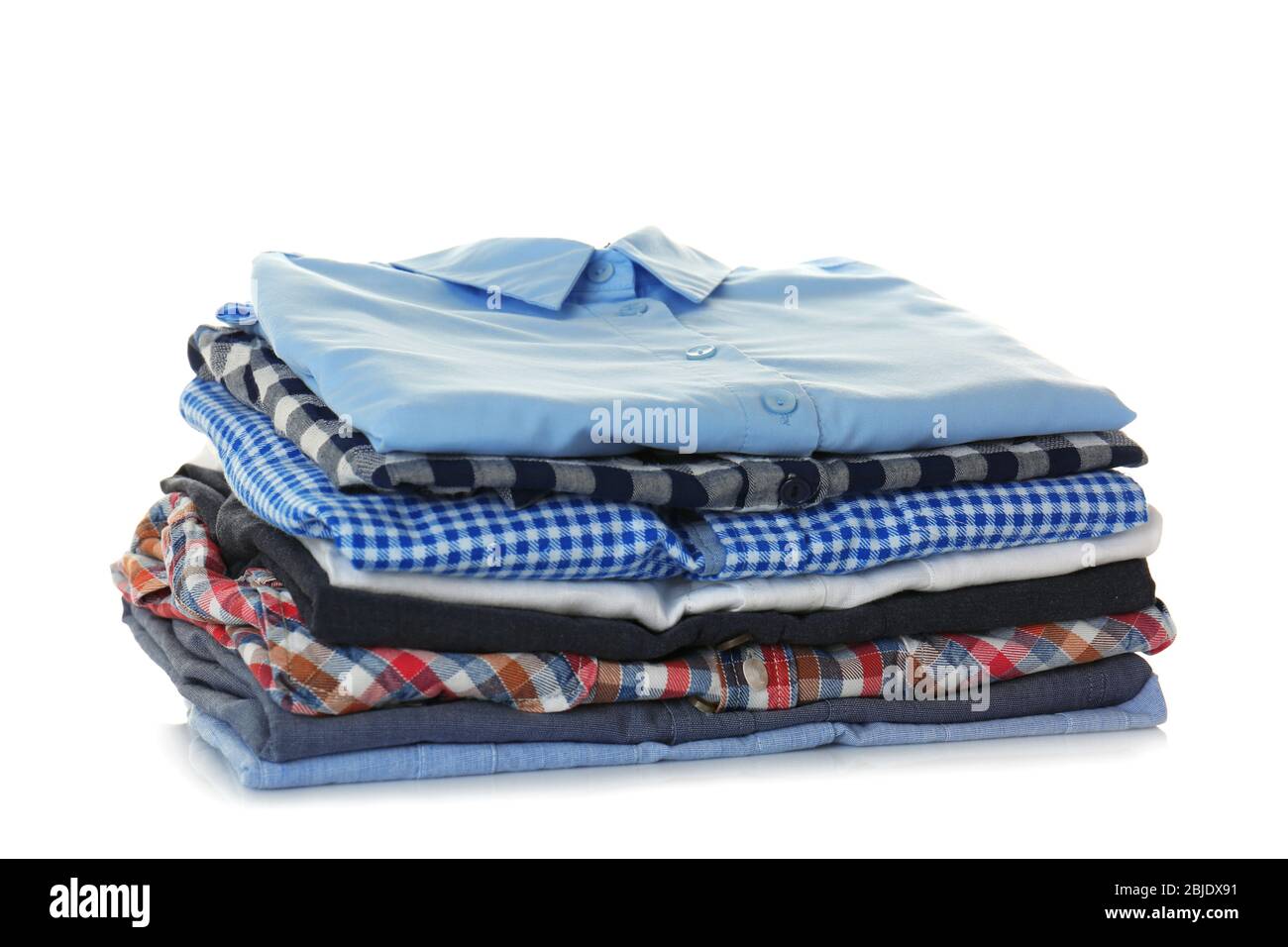 Stack of colorful shirts on white background Stock Photo - Alamy