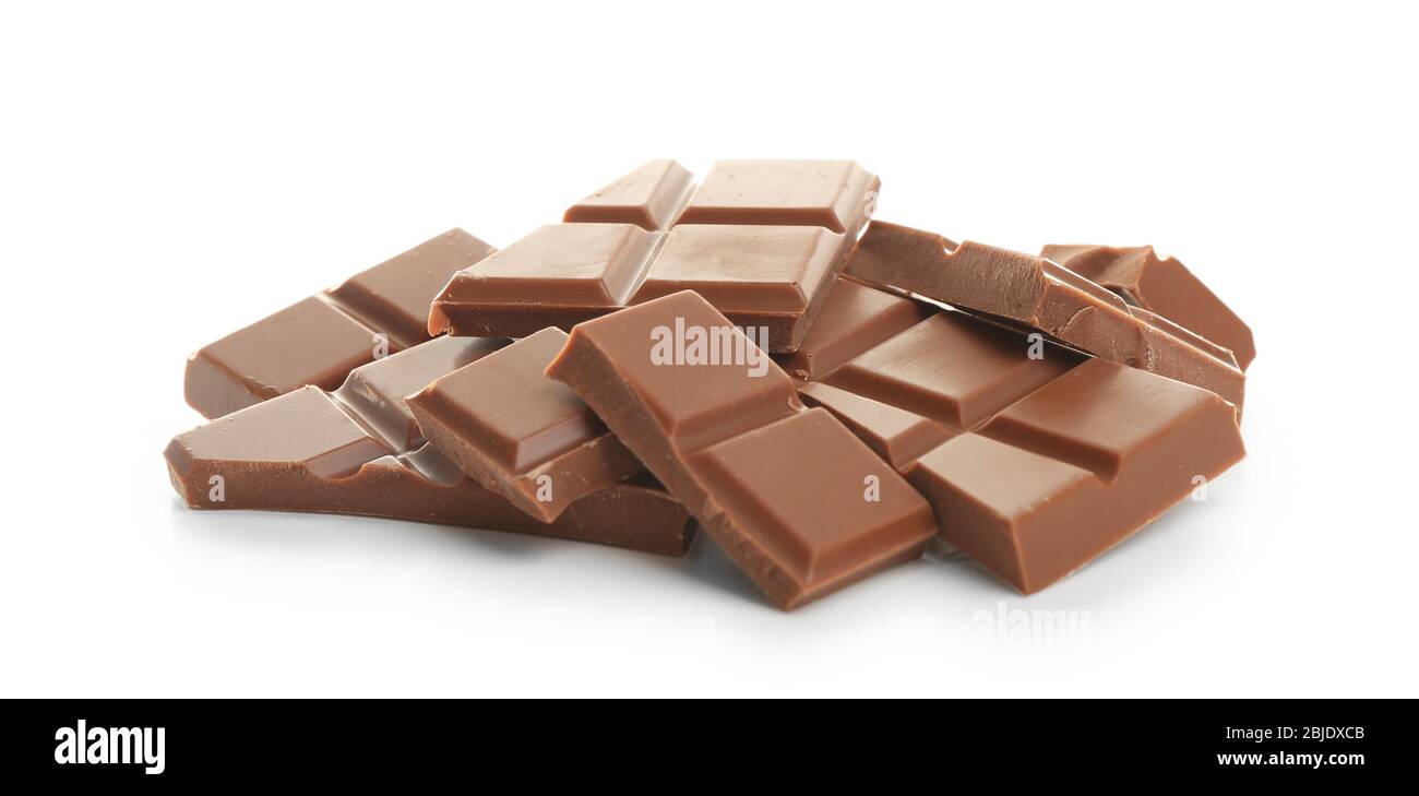 Broken milk chocolate pieces on white background Stock Photo - Alamy