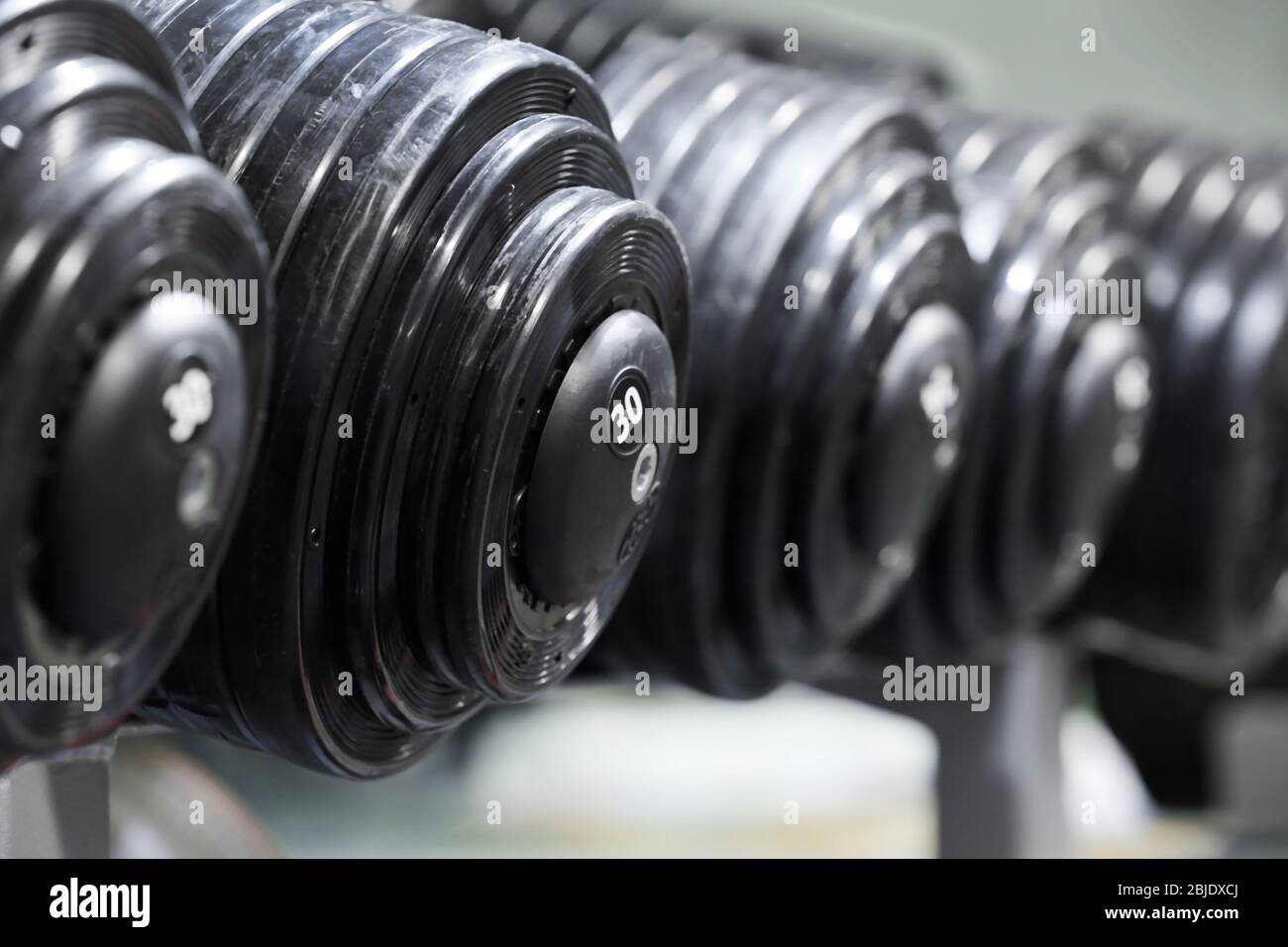 Dumbbells at the gym, close up Stock Photo - Alamy