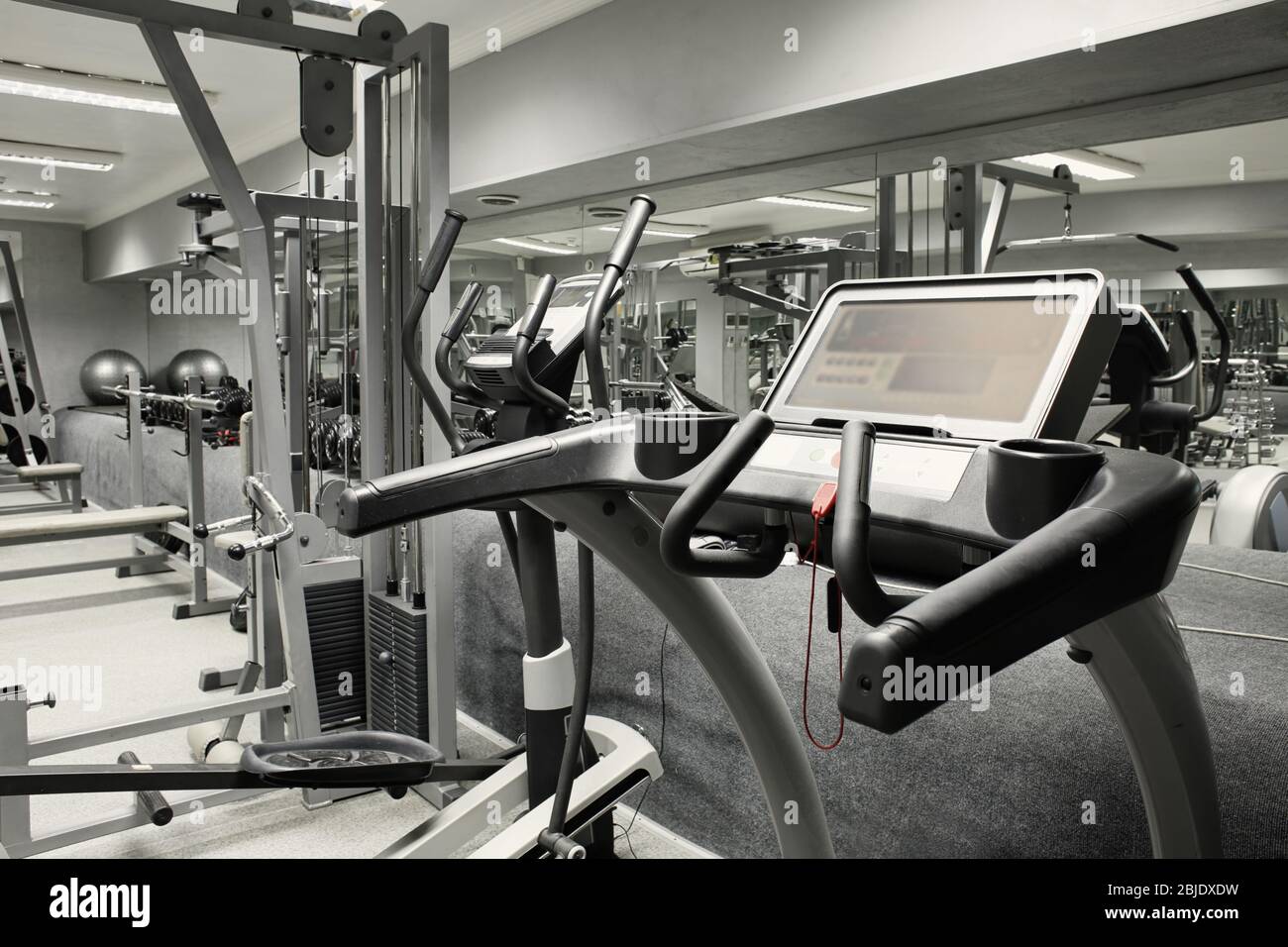 Treadmill in gym interior Stock Photo - Alamy