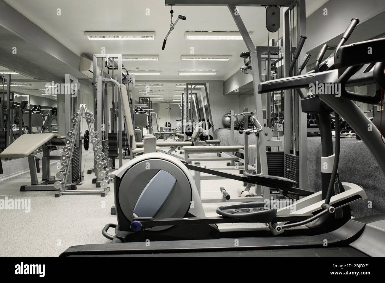 Treadmill in gym interior Stock Photo - Alamy